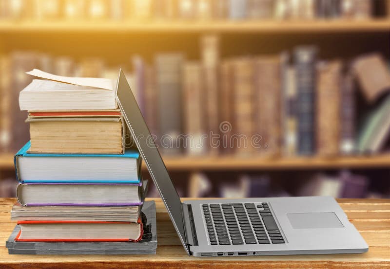 Stack of Books with Laptop on Wooden Table Stock Image - Image of ...