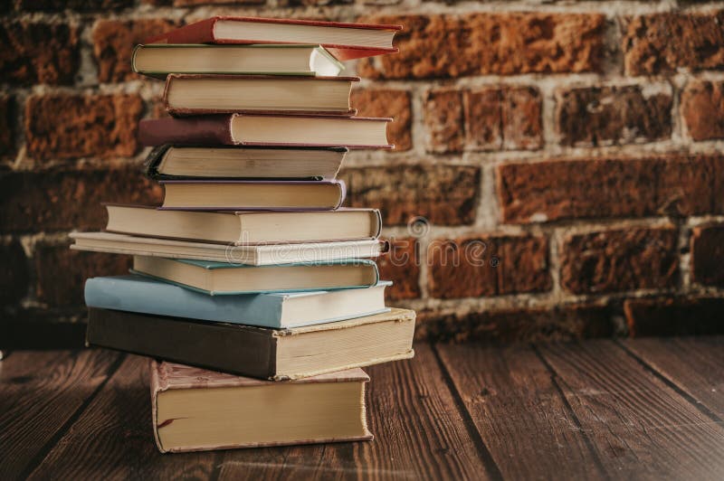Stack of Books in the Library Room Lay on the Wood Table with Brick ...