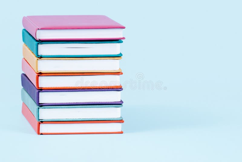 Stack of Books on Light Blue Background. Front View, Copy Space Fot ...