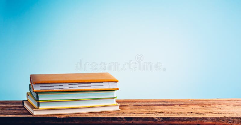 A Stack of Books and Notebooks on Desk or Shelf. Education, Studying ...