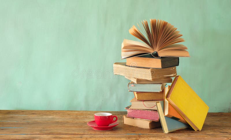 Stack of Books with Open Book and Cup of Espresso Coffee, Reading ...