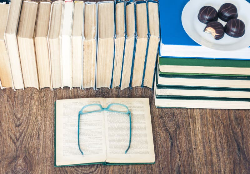 Stack of Books, Open Book, Glasses and Chocolate Cookies White Plate ...