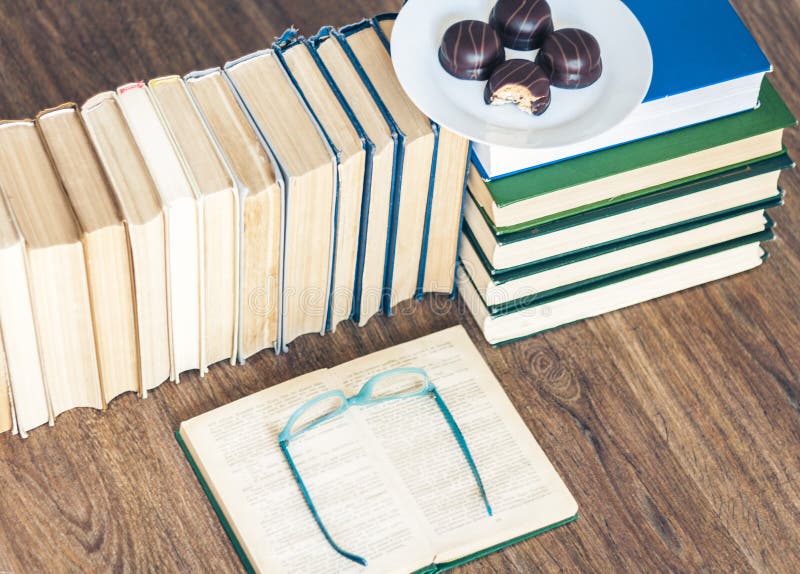 Stack of Books, Open Book, Glasses and Chocolate Cookies White Plate ...
