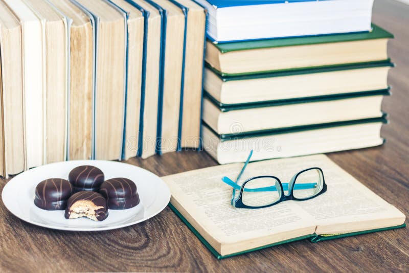 Stack of Books, Open Book, Glasses and Chocolate Cookies White Plate ...