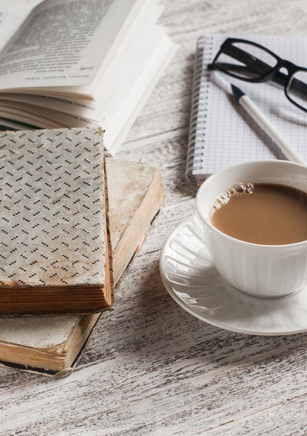 A Stack of Books, Open Clean Notepad, Glasses and a Cup of Cocoa on a ...