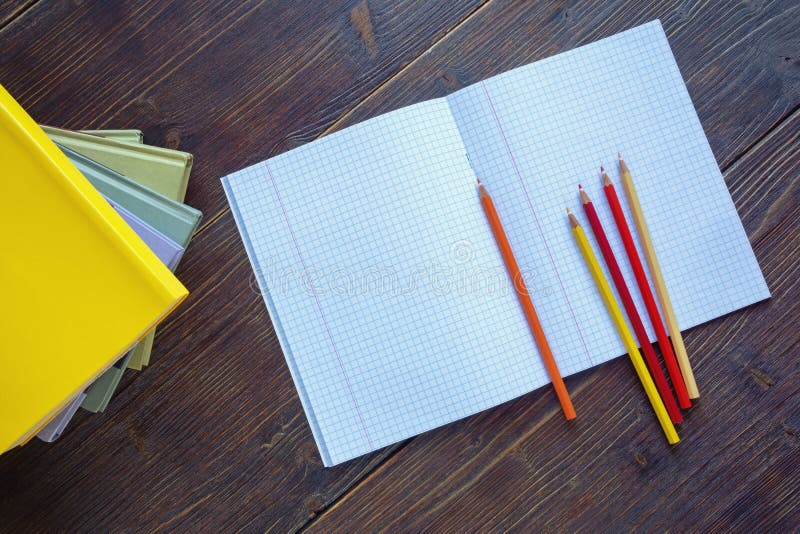 Stack of Books and Open Notebook on Rustic Table. Copy Space Stock ...