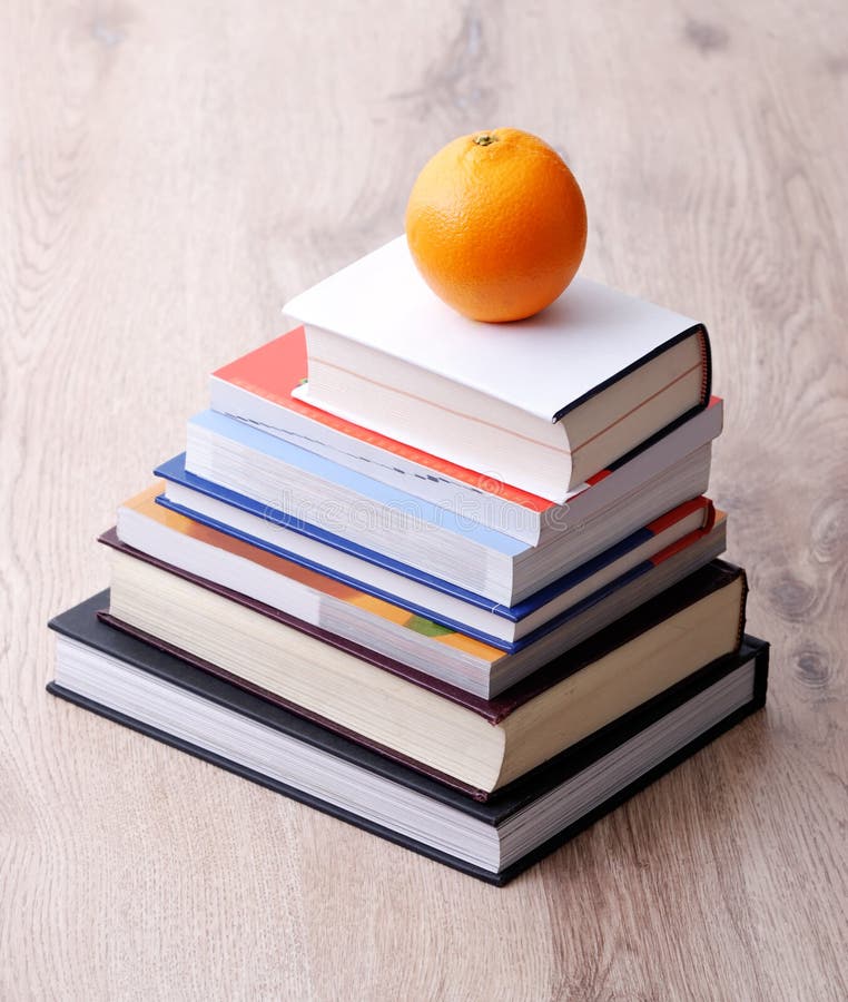 Stack of Books with Orange on Top Stock Photo - Image of life, stack ...