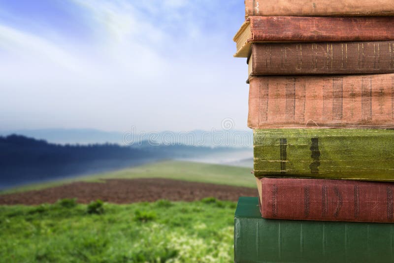 Stack of Books Over the Natural Background Stock Image - Image of ...