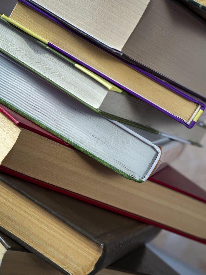 A Stack of Books Photographed at an Angle. Thick Books in a Stack are ...