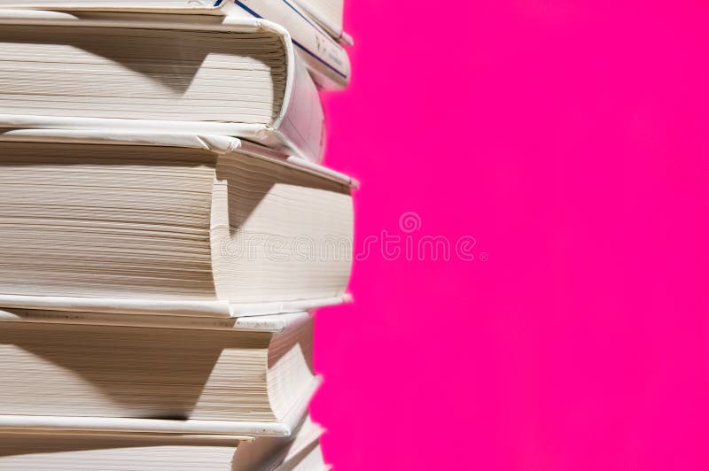Stack of books on pink stock photo. Image of pile, volume - 6519922