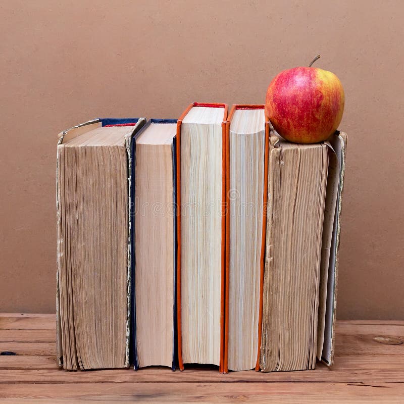 Stack of Books and Red Apple on Wooden Table Stock Photo - Image of ...