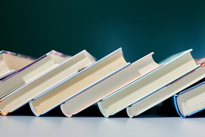 Stack of Books in a Row with on Dark Background Stock Photo - Image of ...
