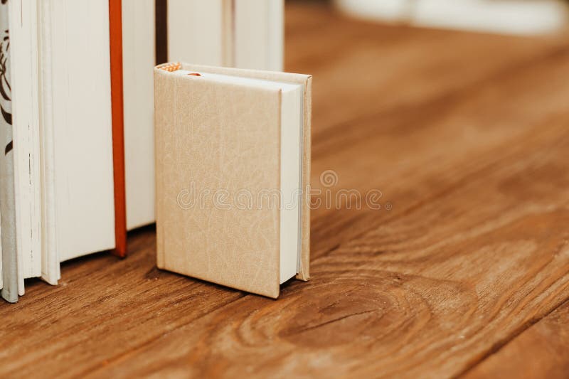 A Stack of Books Stand on the Tables, Stacked in the Frame, Next To ...