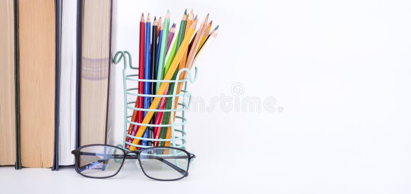 A Stack of Books, Study Guides, Textbooks, Glasses, and Pencils in a ...