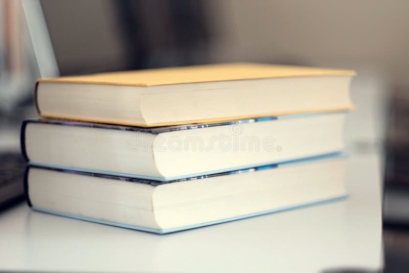 Stack of books on a table stock photo. Image of clever - 149388704