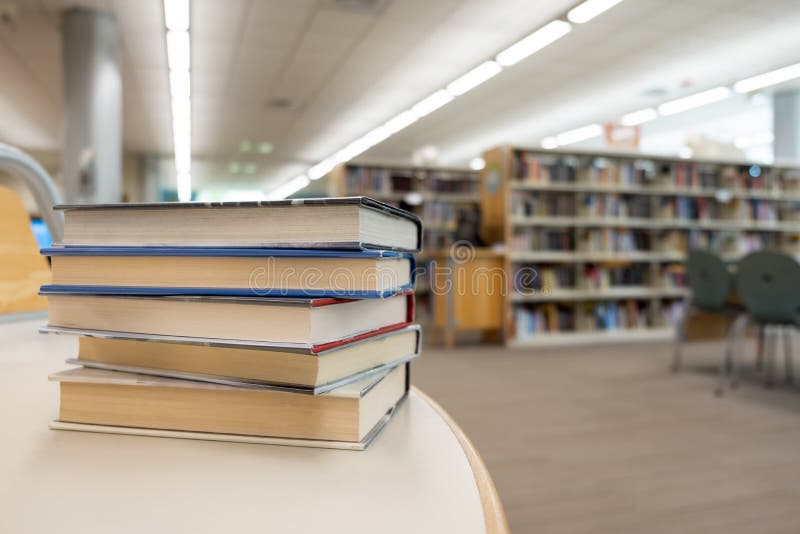 Stack of Books on Table at Library Stock Image - Image of stack, learn ...