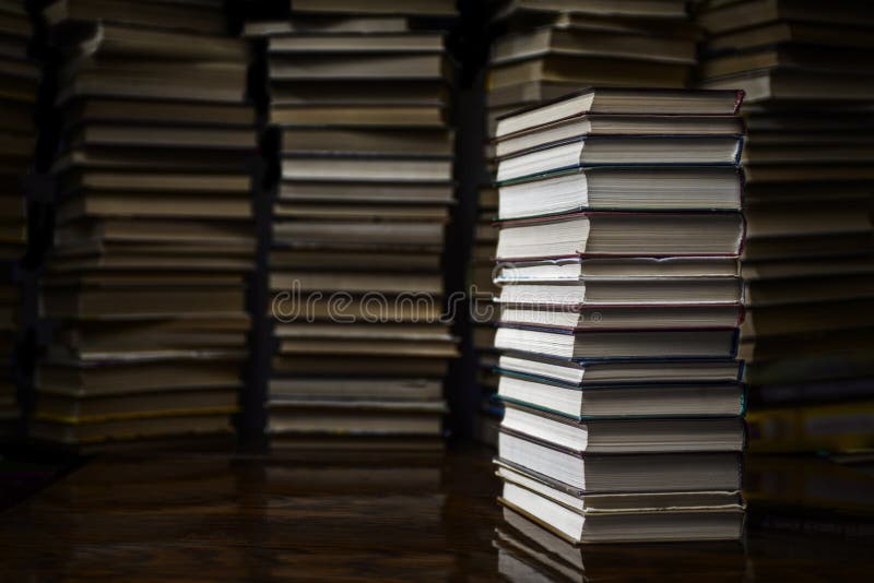 Stack of Books on Table at Library. Book Stack on Wood Desk on Books ...