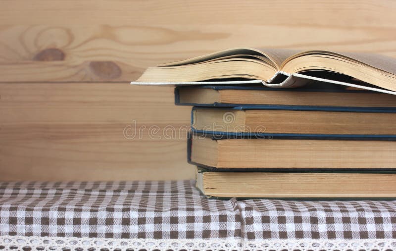 Stack of Books on the Table. Open Hardcover Book. Stock Image - Image ...