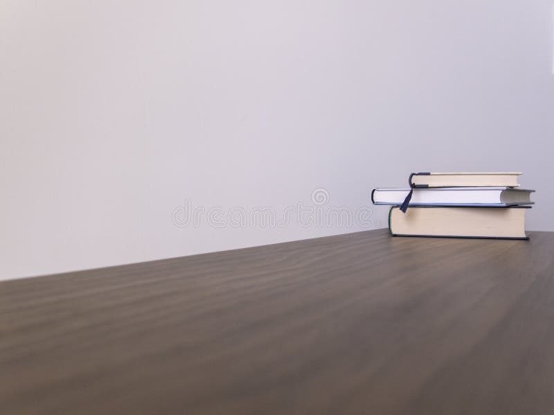 Stack of Books on a Table with Light Colored Background.Education ...
