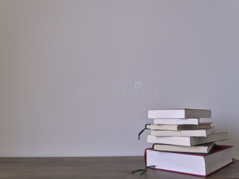 Stack of Books on a Table with Light Colored Background.Education ...