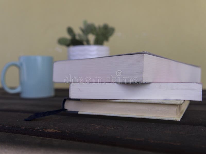 Stack of Books on a Table with Light Colored Background.Education ...