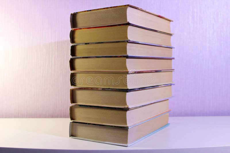 A Stack of Books on the Table Stock Image - Image of cardboard, shelf ...