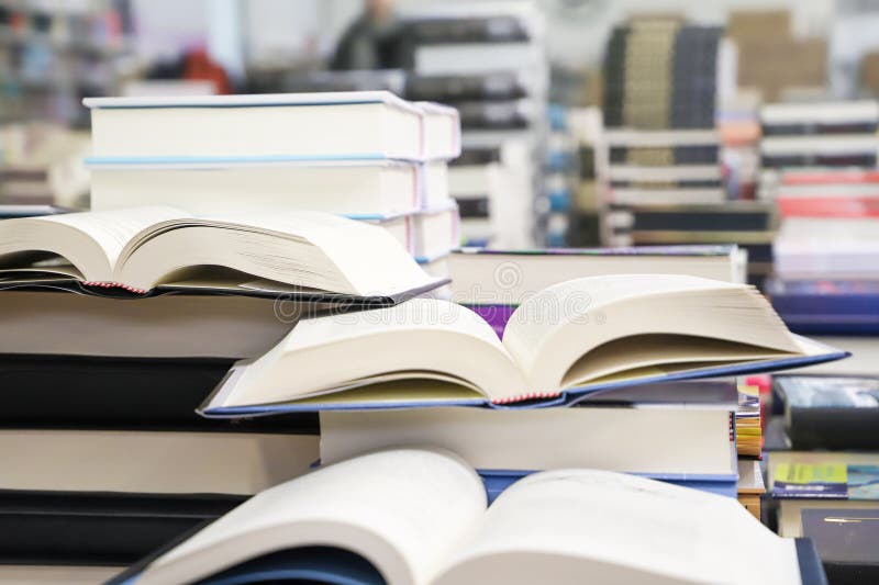 Stack of Books on the Table. Open Book. Back To School Concept Stock ...