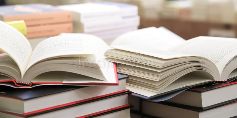 Stack of Books on the Table. Open Book. Back To School Concept Stock ...