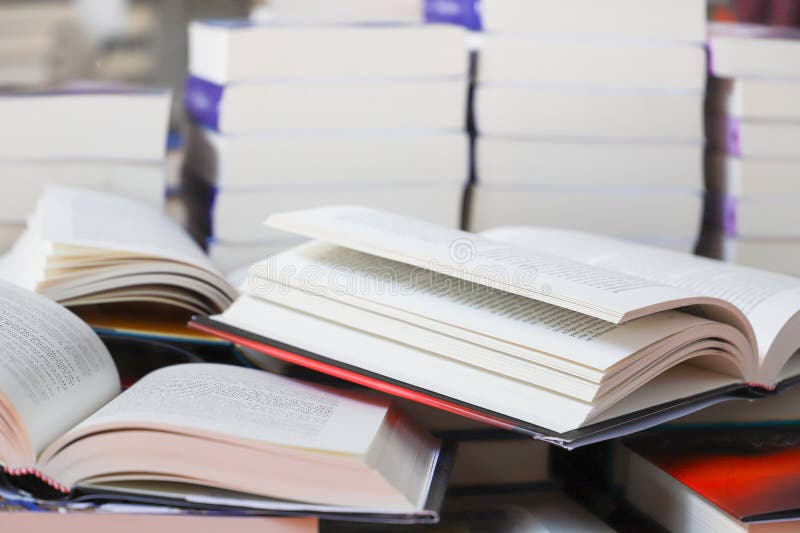 Stack of Books on the Table. Open Book. Back To School Concept Stock ...