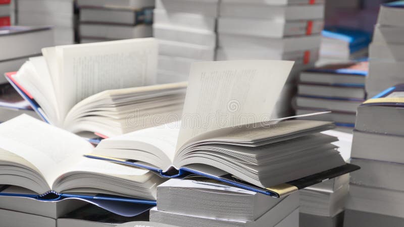 Stack of Books on the Table. Open Book. Back To School Concept Stock ...