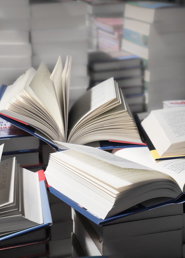 Stack of Books on the Table. Open Book. Back To School Concept Stock ...