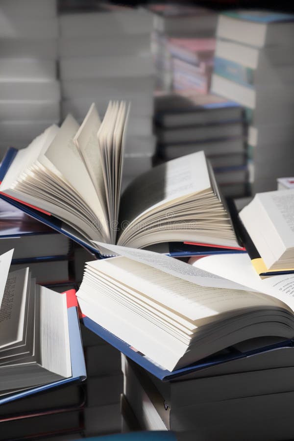 Stack of Books on the Table. Open Book. Back To School Concept Stock ...