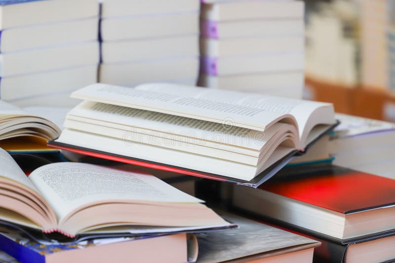 Stack of Books on the Table. Open Book. Back To School Concept Stock ...