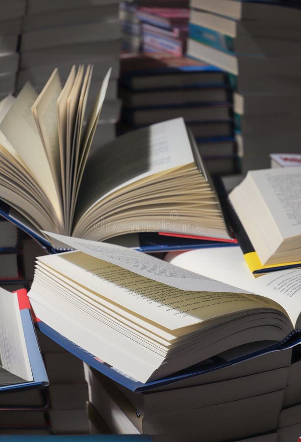 Stack of Books on the Table. Open Book. Back To School Concept Stock ...