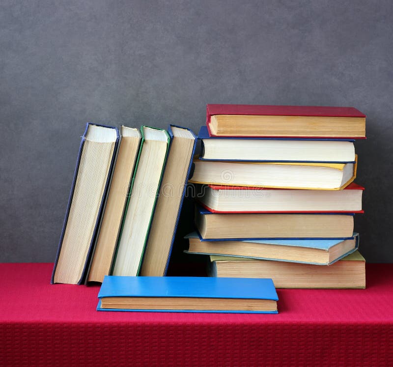 Stack of Books on the Table with a Red Tablecloth. Stock Photo - Image ...