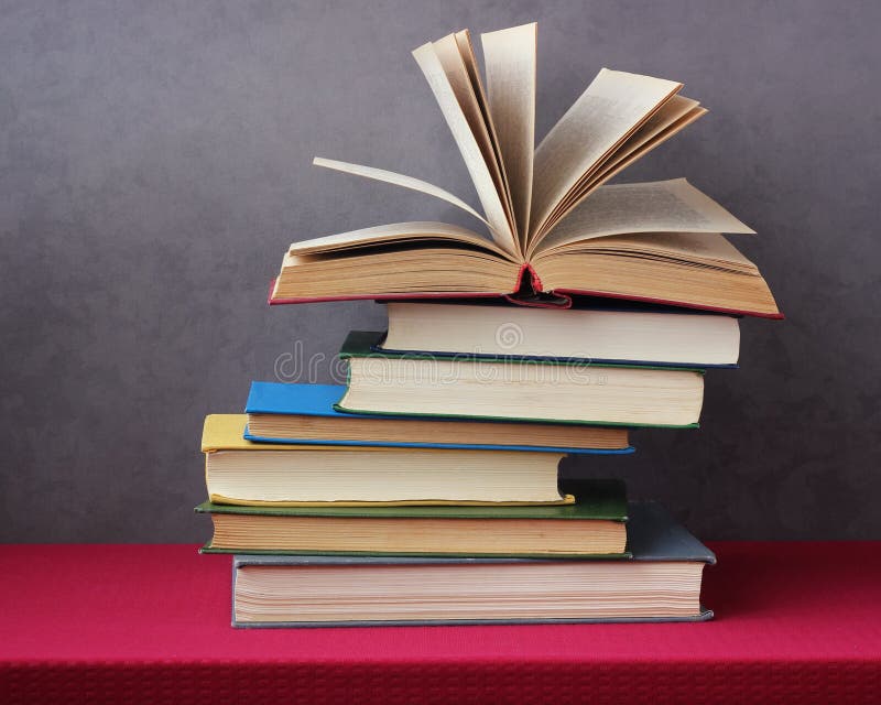 Stack of Books on the Table with a Red Tablecloth. Stock Photo - Image ...