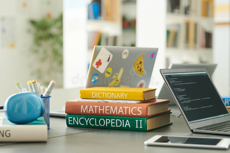 Stack of Books on Table in School Library Stock Image - Image of gadget ...