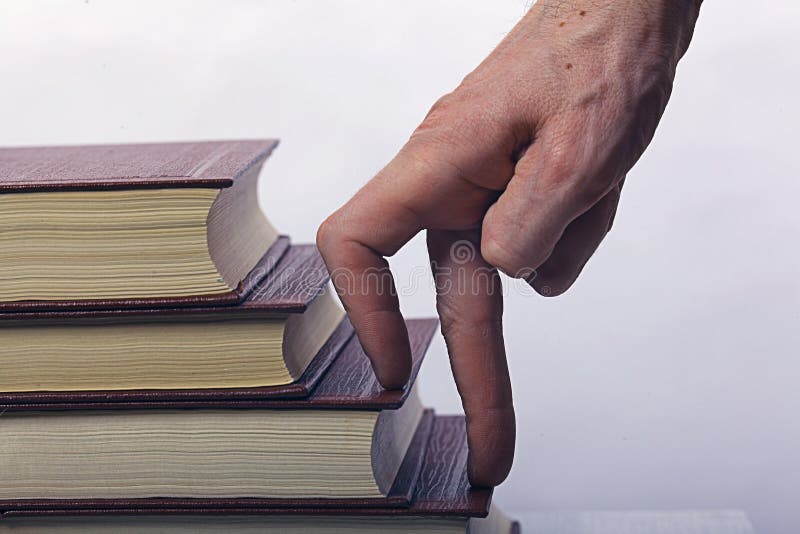 Stack of books thumbs hand stock image. Image of fingers - 50122595