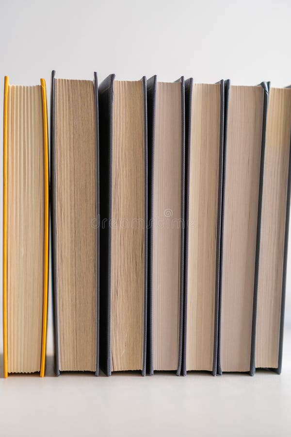 Stack of Books on a White Background. One Book is Yellow Stock Image ...