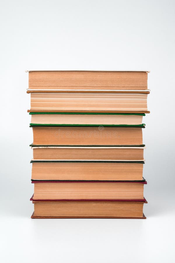 A Stack of Books on a White Background. Side View Stock Photo - Image ...