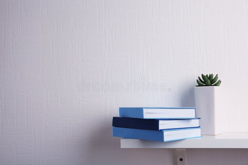 Stack of Books on White Shelf Stock Photo - Image of book, literature ...