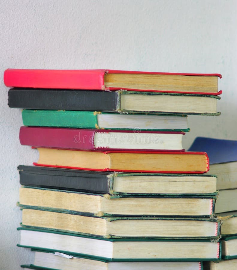 Stack of Books with White Wall Background Stock Image - Image of ...