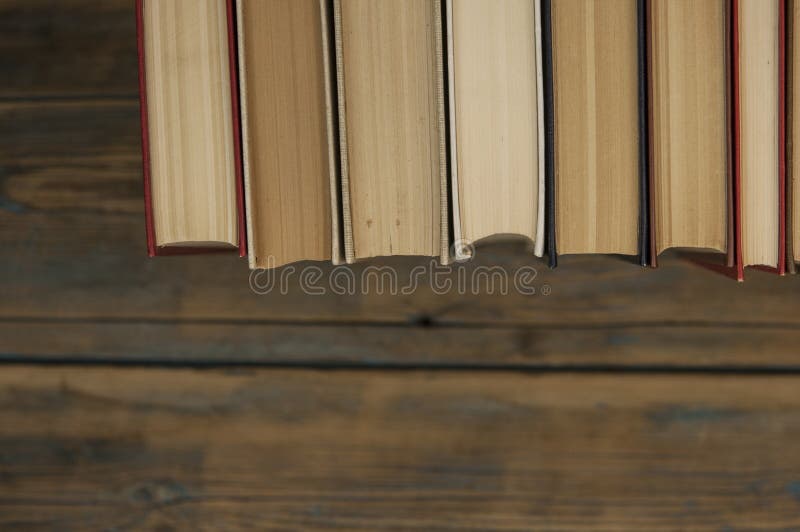 Stack of Books on Wooden Table Over Rustic Background with Copy Space ...