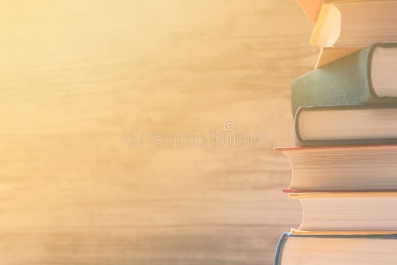 Stack of Books on Wooden Background Stock Photo - Image of pile ...