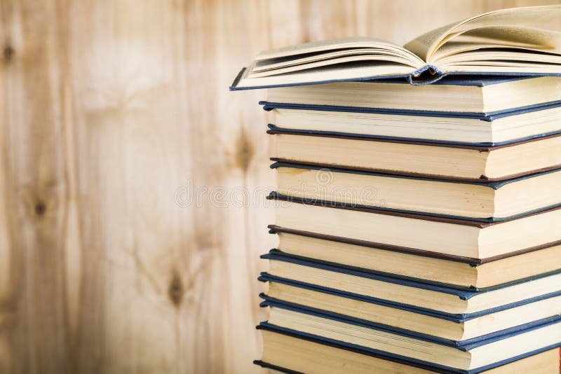 Stack of Books on a Wooden Background. Stock Image - Image of design ...