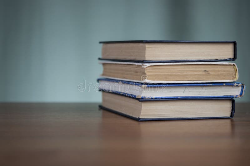 Stack of Books on a Wooden Background. Vintage Old Books on Brown ...