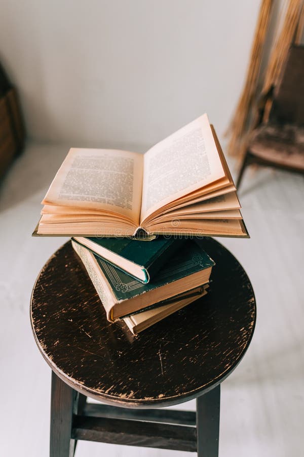 Stack of Books on Wooden Chair in Living Room Stock Image - Image of ...