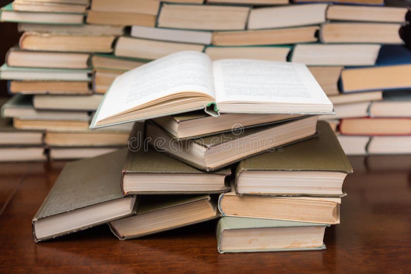 Big Stack of Books on the Wooden Table Stock Photo - Image of group ...