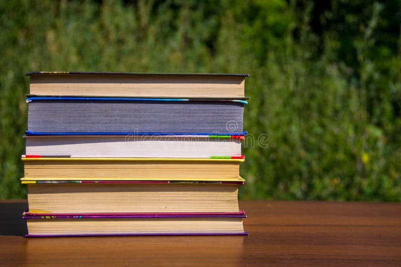 Stack of the Books on Wooden Table Stock Photo - Image of brown, green ...