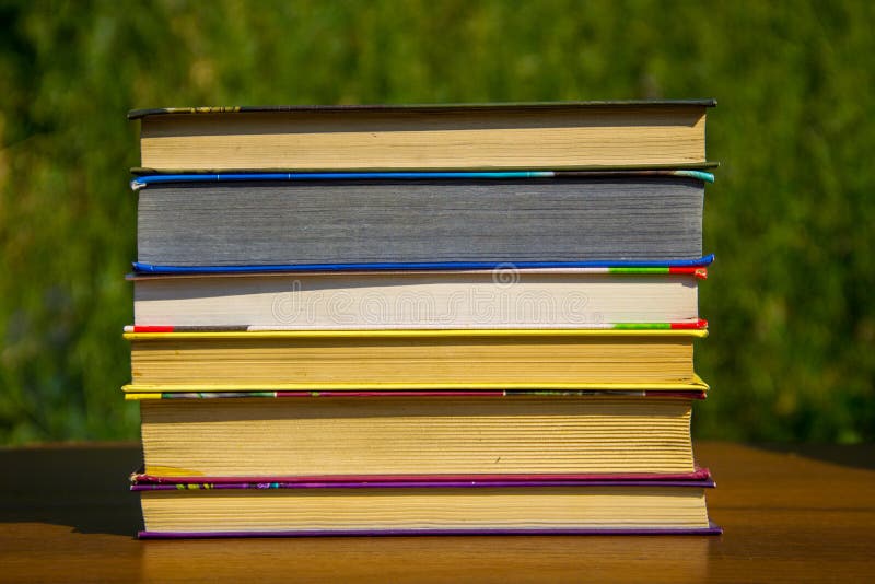 Stack of the Books on Wooden Table Outdoor Stock Photo - Image of bokeh ...